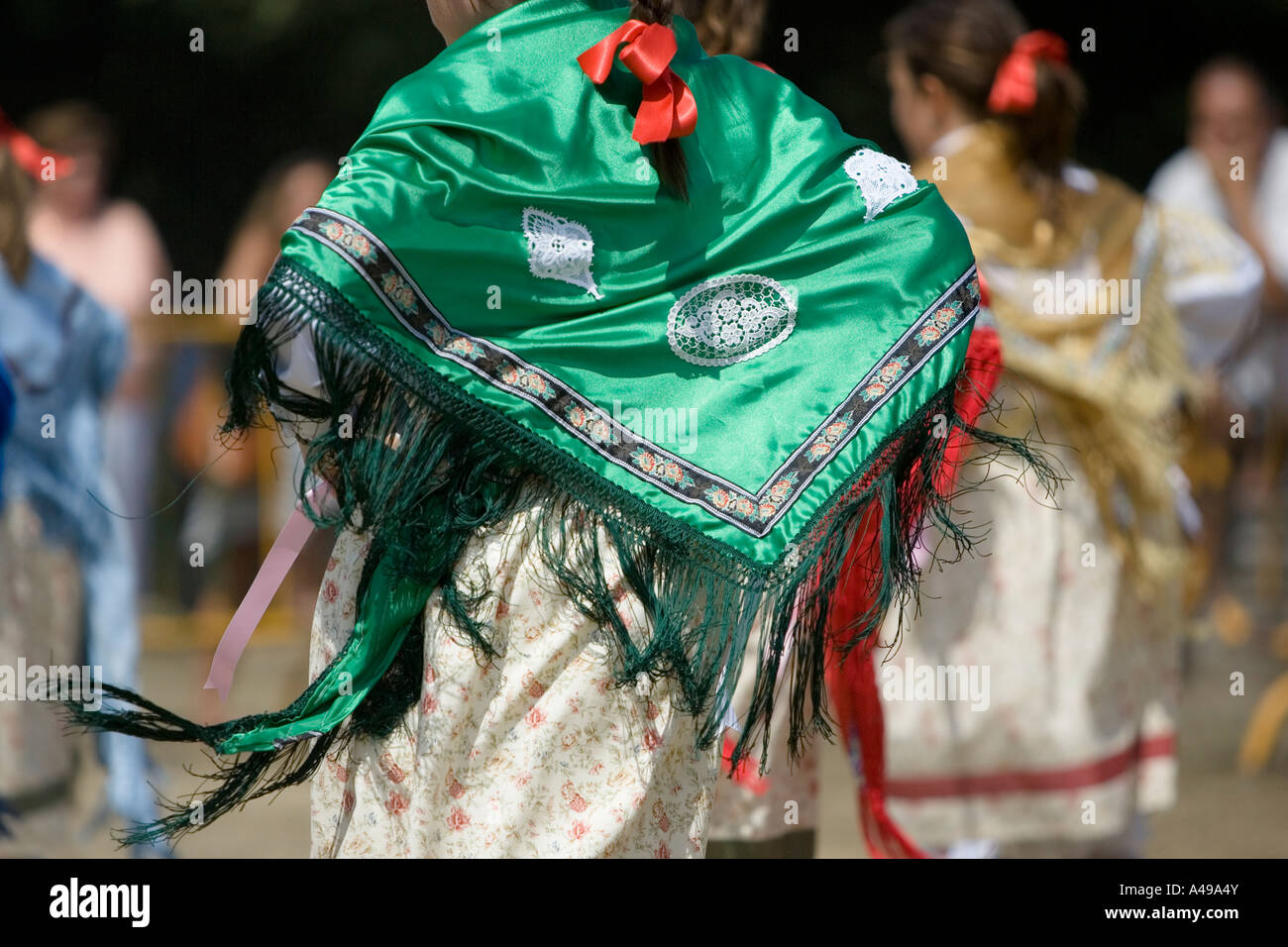 Colourful traditional green shawl of Basque woman performing folk dance ...