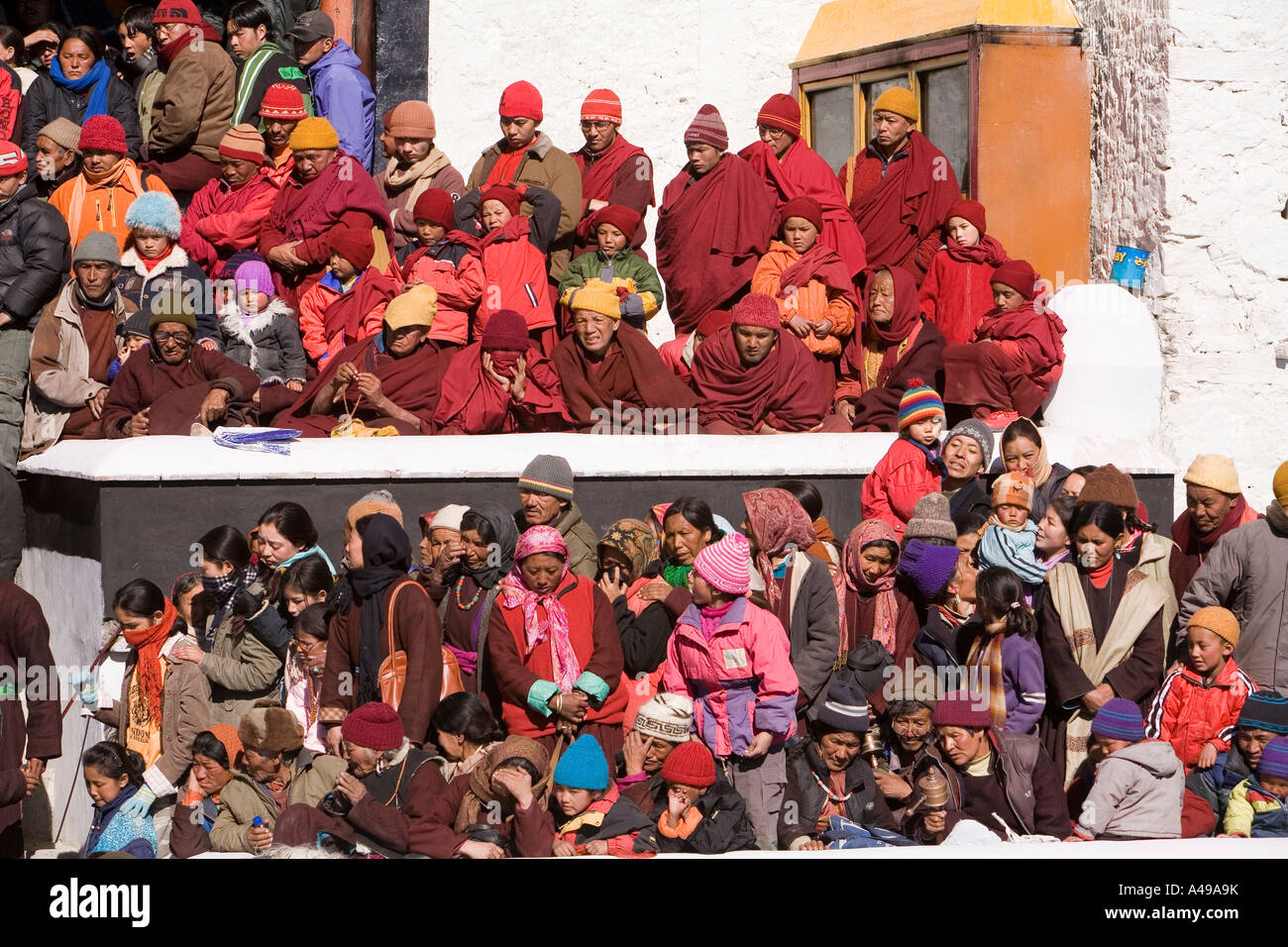 India Ladakh Leh Valley Spitok Gompa festival crowd of monks and local ...