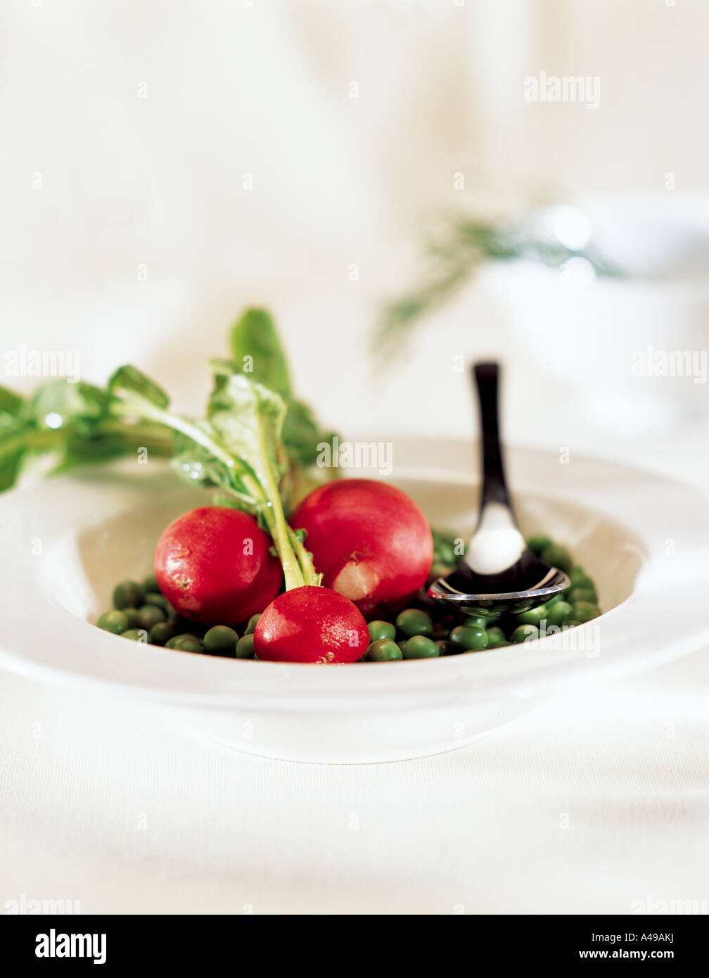 Close-up of common beet in a bowl of green peas Stock Photo - Alamy