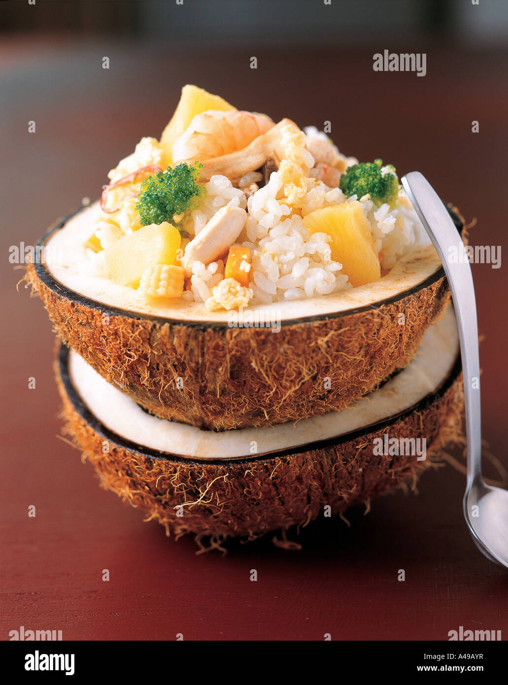 High angle view of fried rice served in coconut shells Stock Photo - Alamy