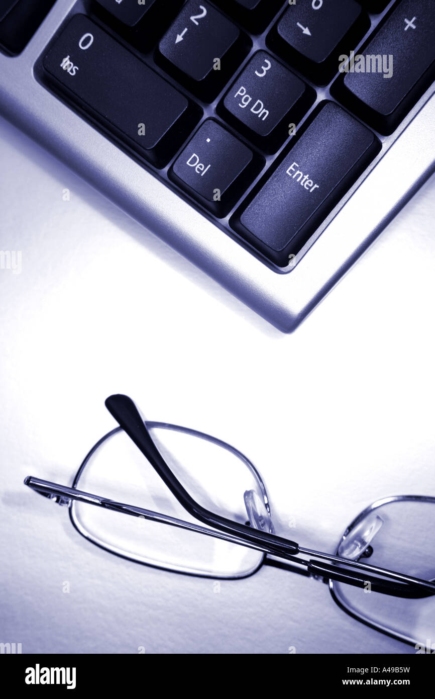Computer keyboard and glasses Stock Photo - Alamy