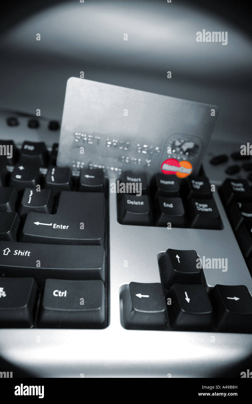 Credit card in keys of computer keyboard Stock Photo - Alamy