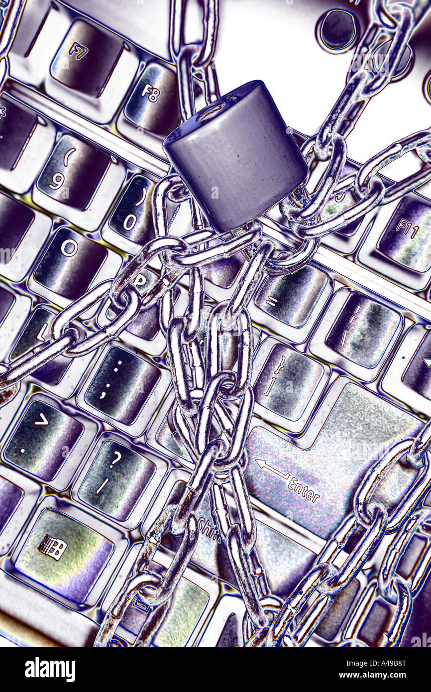 Padlock and chain around computer keyboard Stock Photo - Alamy