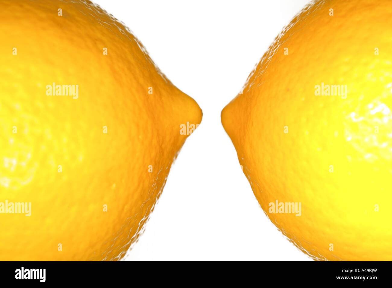 Two lemons on a white background Stock Photo - Alamy