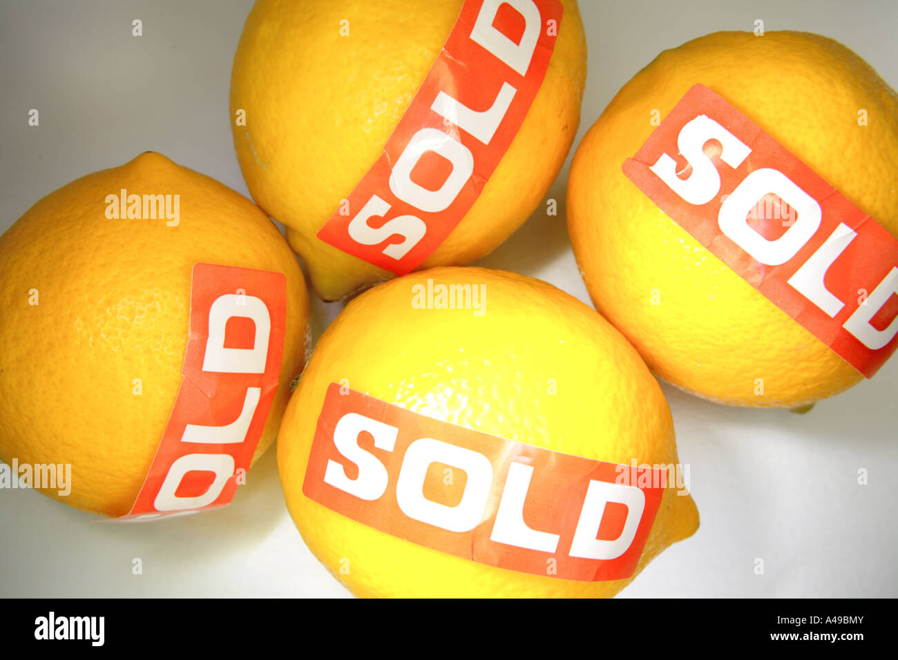 Sold stickers on lemons Stock Photo - Alamy