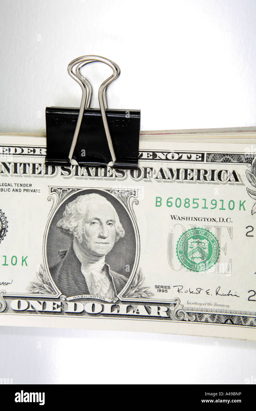 Cash in clip Stock Photo - Alamy