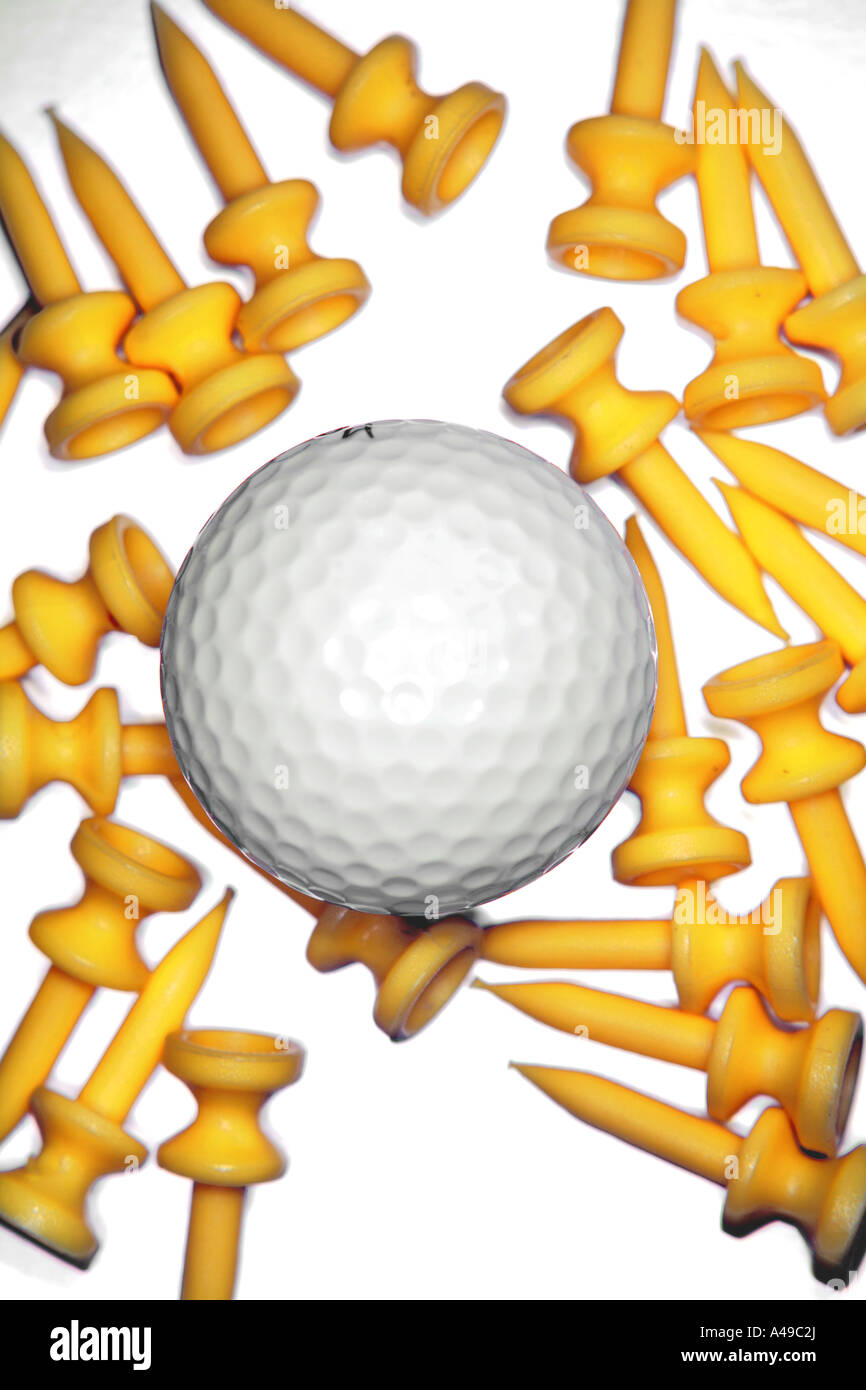 Golf ball and yellow tees Stock Photo - Alamy