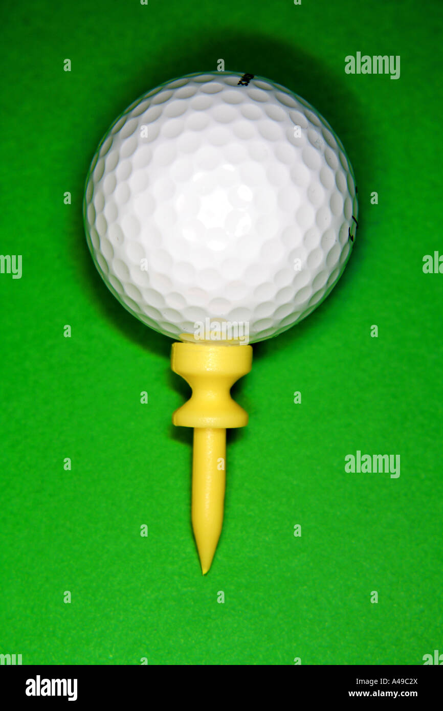 Golf ball and tee Stock Photo - Alamy