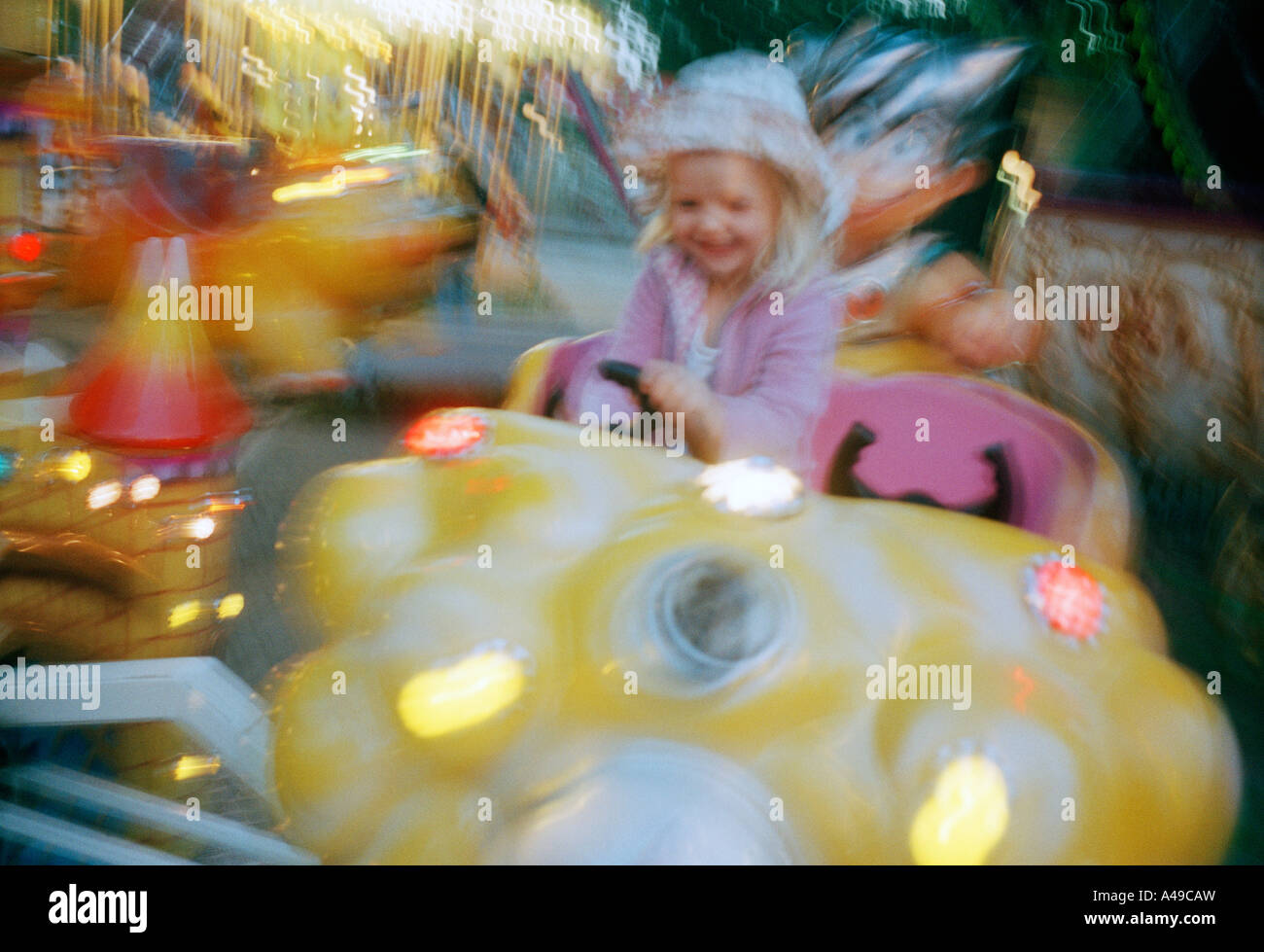 Little girl in a roller coaster. Faster, daddy! Stock Photo - Alamy