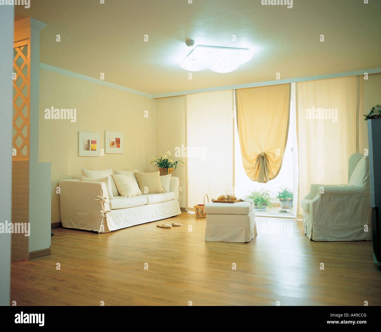 Empty couch and an armchair in the living room Stock Photo - Alamy