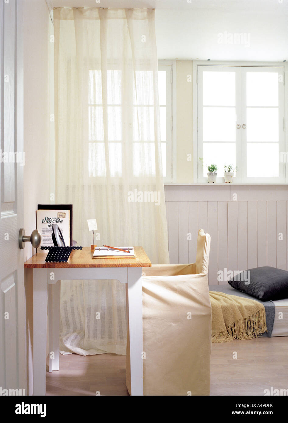 Empty chair and a desk in the bedroom Stock Photo - Alamy