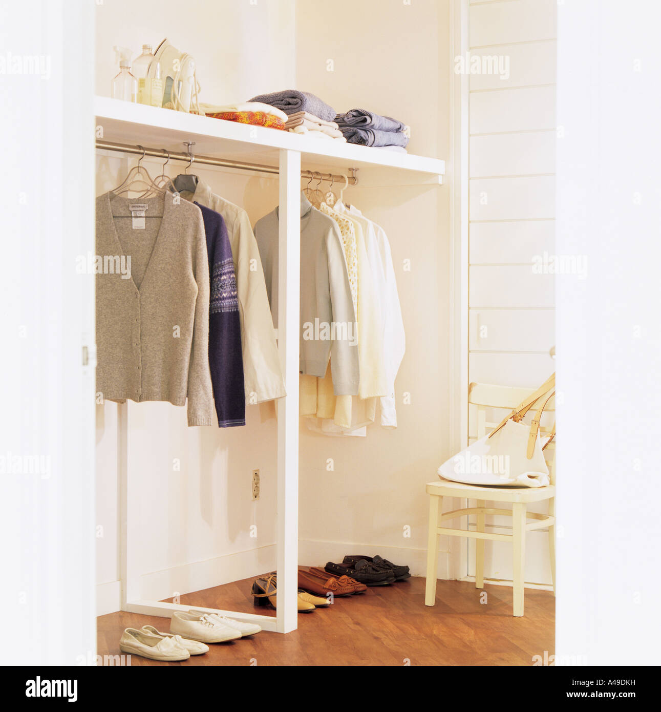 Clothes hanging on hangers Stock Photo - Alamy