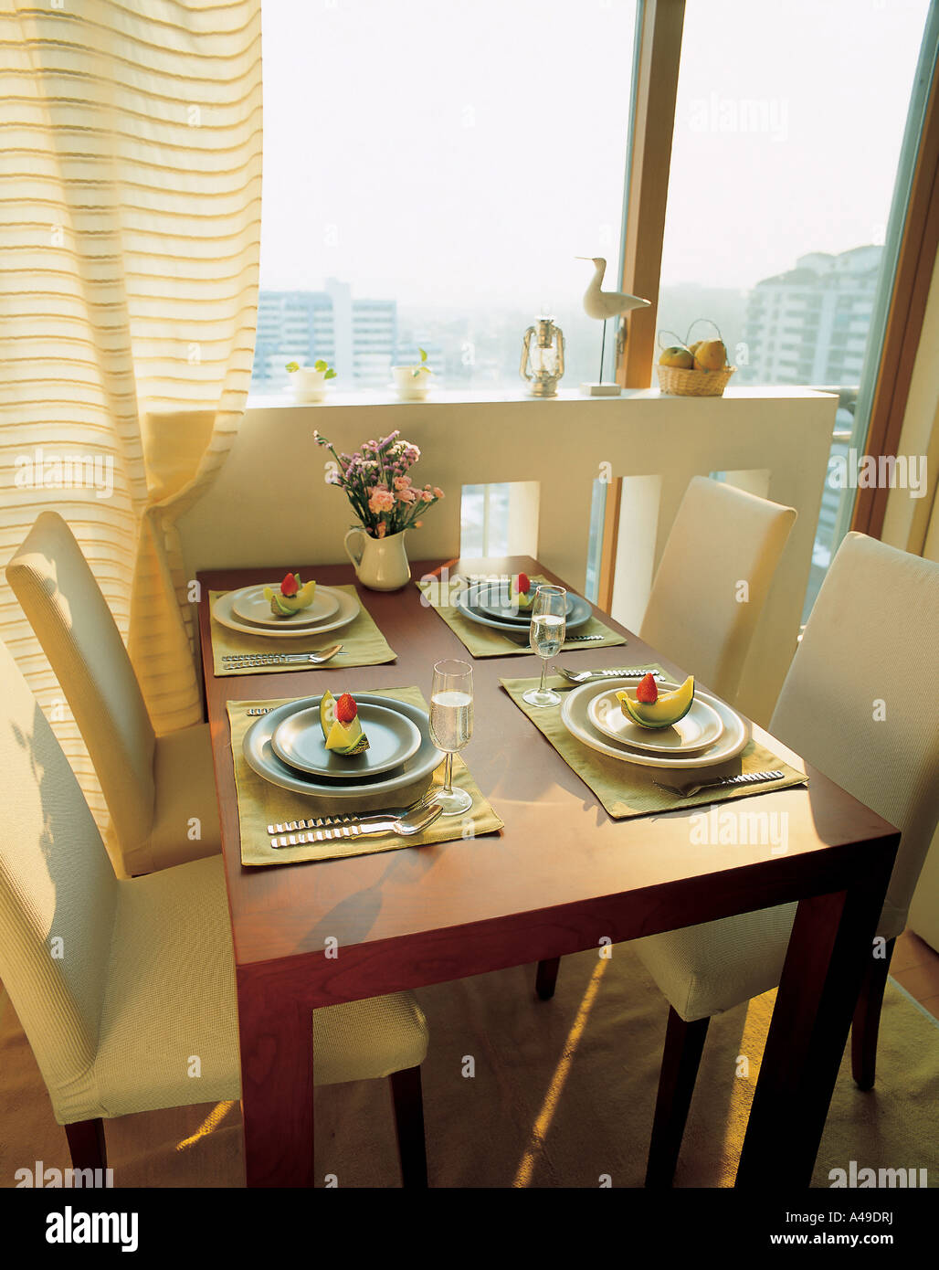 Empty chairs and a dining table in the dining room Stock Photo - Alamy
