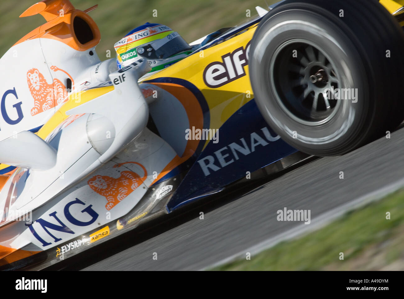 Giancarlo Fisichella ITA races his Renault R27 racecar down the track ...
