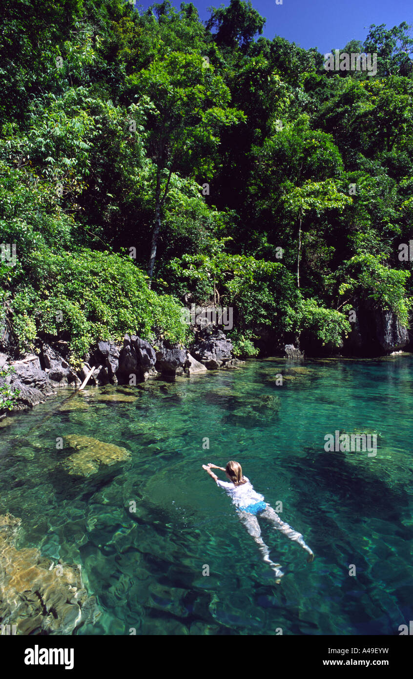 Lone traveller swimming in Kayanga lake, the cleanest lake in the ...
