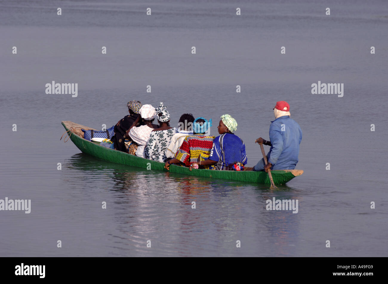 Canoe crossing from Kartung The Gambia the river is the border with ...