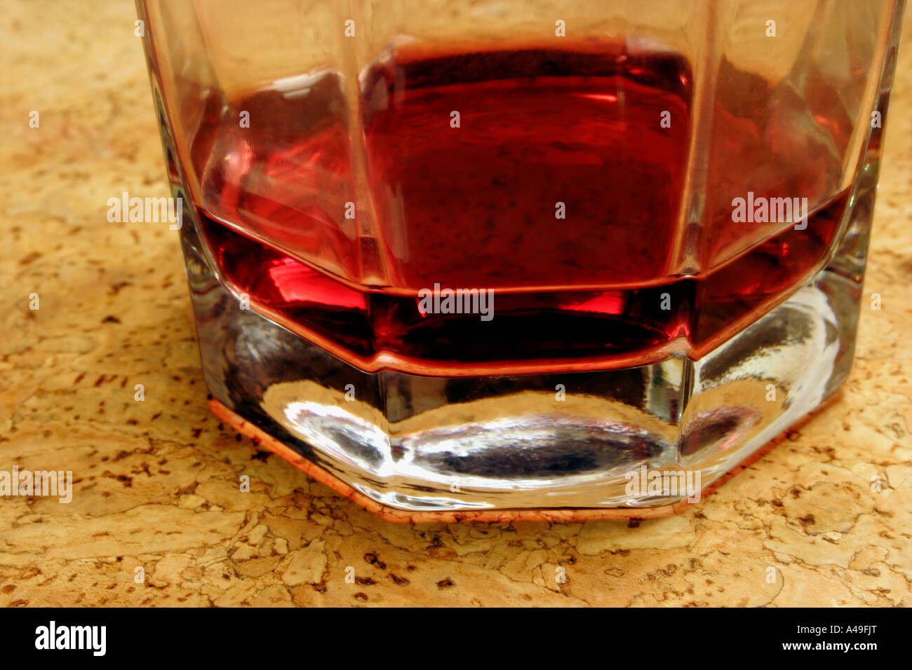 Almost empty glass of alcoholic drink Stock Photo - Alamy