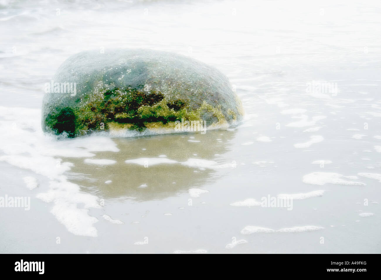 Rock surrounded by sea Digitally altered Stock Photo - Alamy