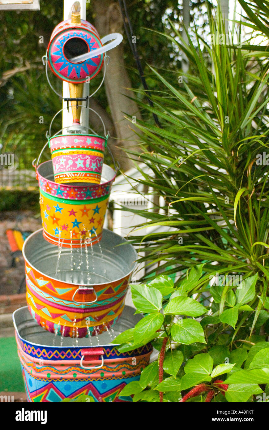 USA Florida Keys Colorful arrangement of water tubs and greenery at B ...