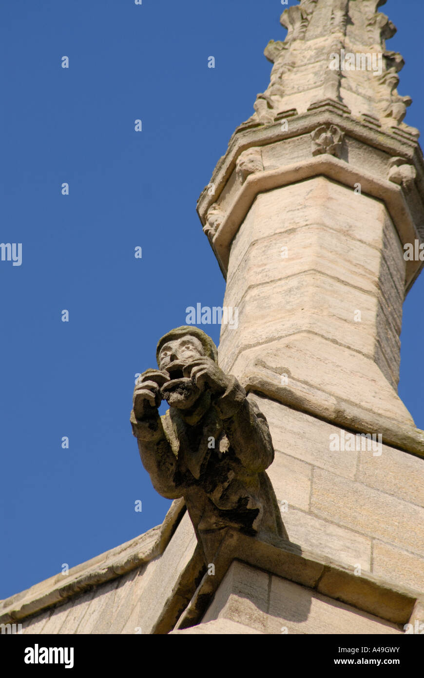 Gargoyle in the form a priest pulling a face on The brand new tower of ...