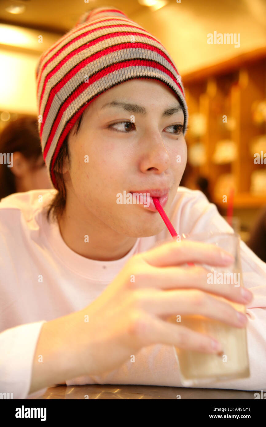 Asian man drinking cold coffee hi-res stock photography and images - Alamy