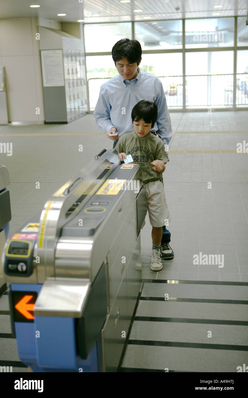 Father and his son at a subway station Stock Photo - Alamy