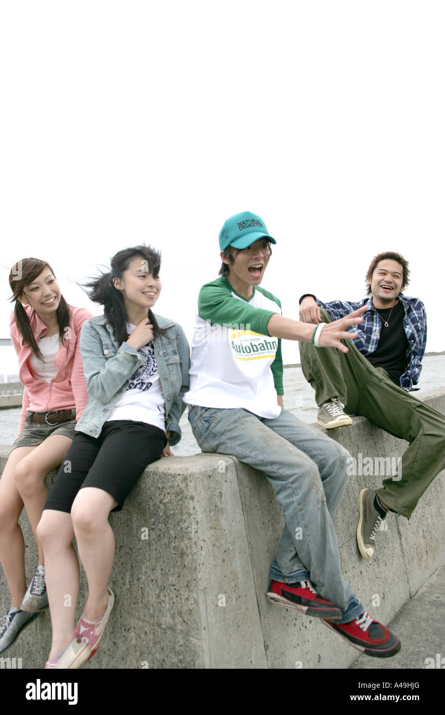 Two young couples smiling and shouting Stock Photo - Alamy