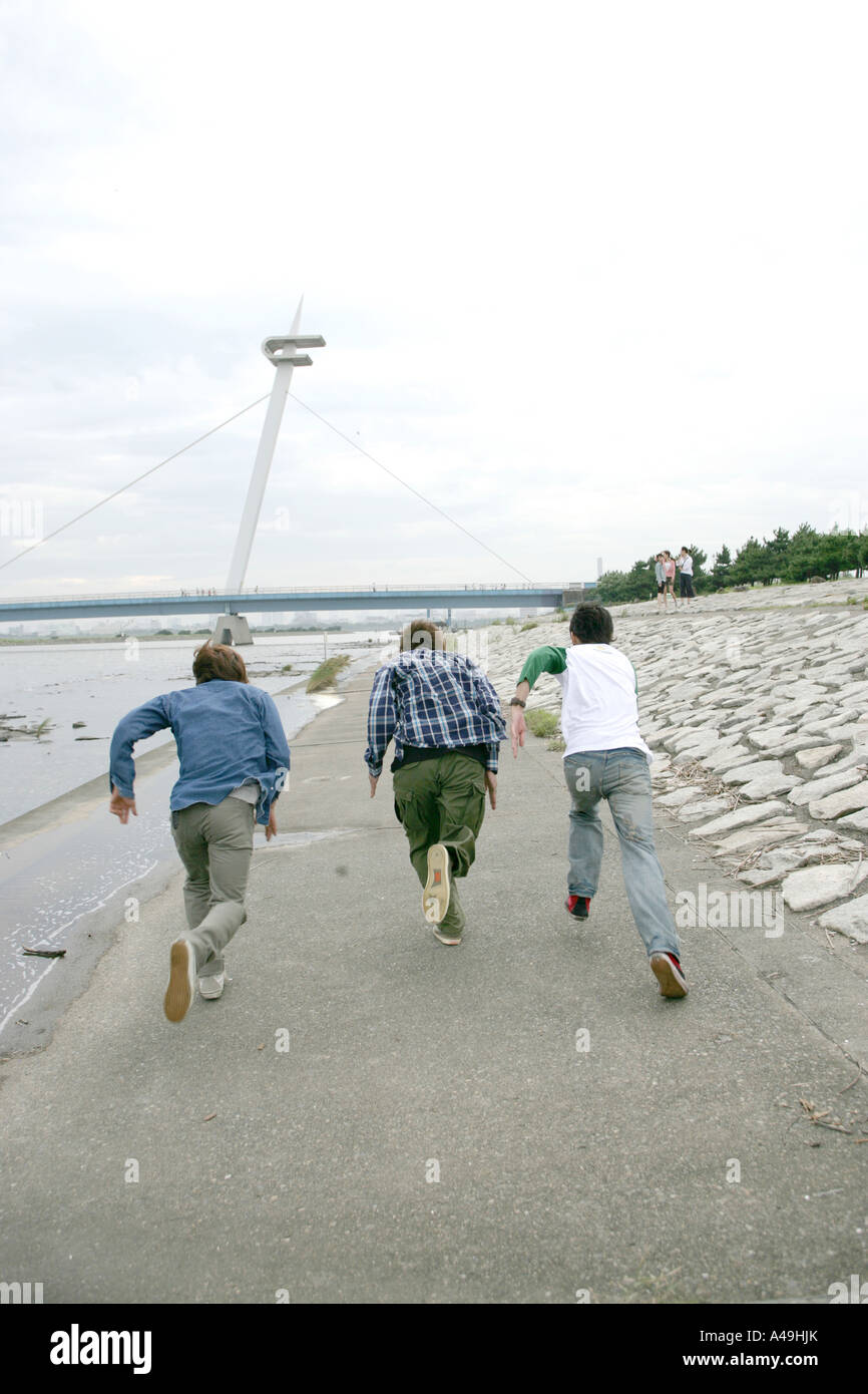 Rear view of three men running hi-res stock photography and images - Alamy