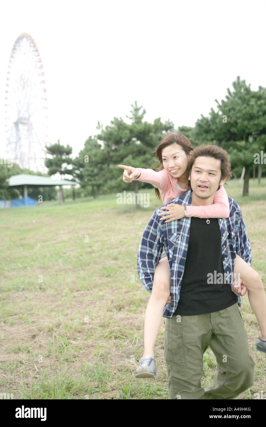 Back view pointing walking woman hi-res stock photography and images ...