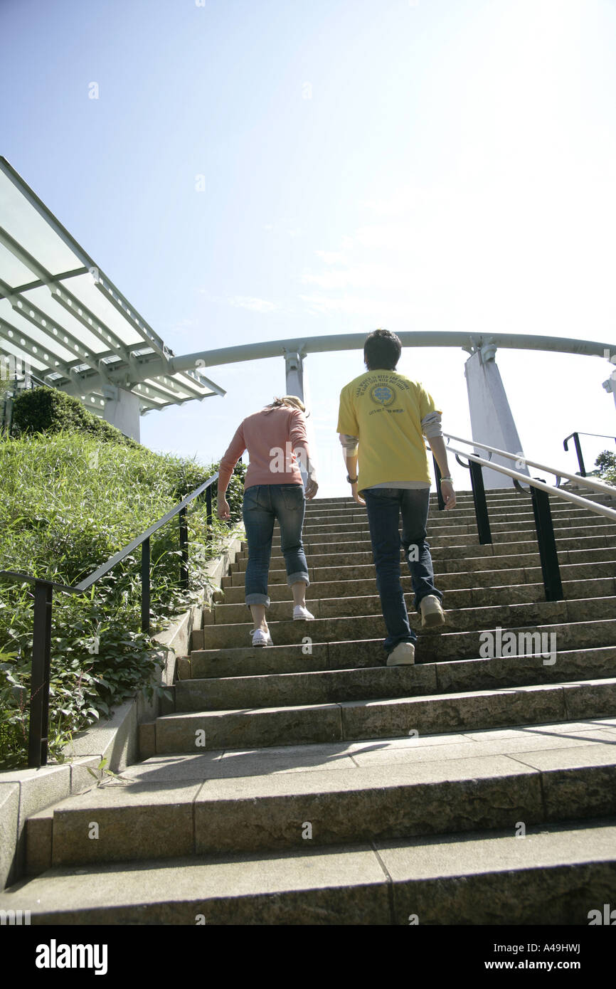 Rear view of a man walking up steps hi-res stock photography and images ...