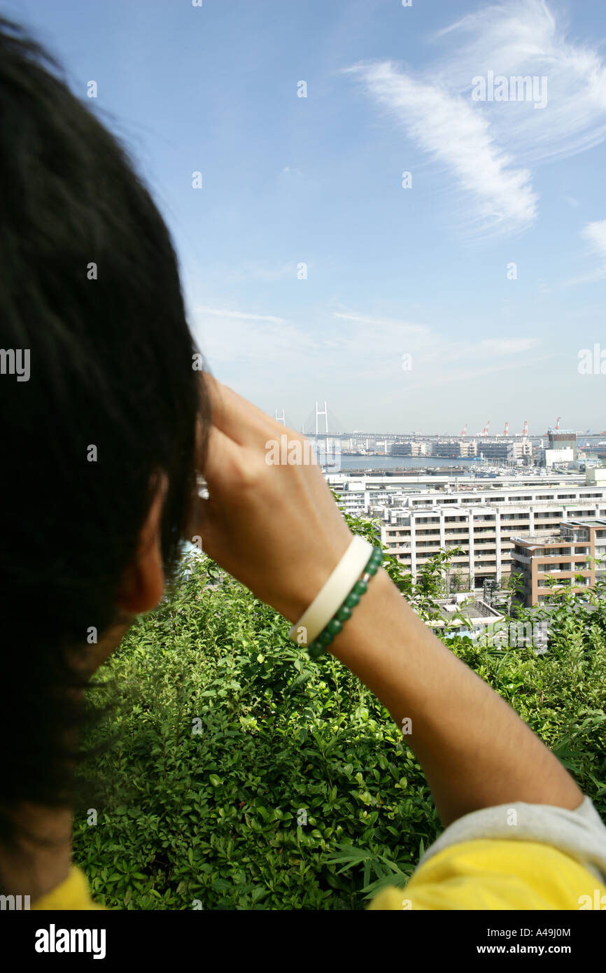 Rear view of a man looking at a view Stock Photo - Alamy