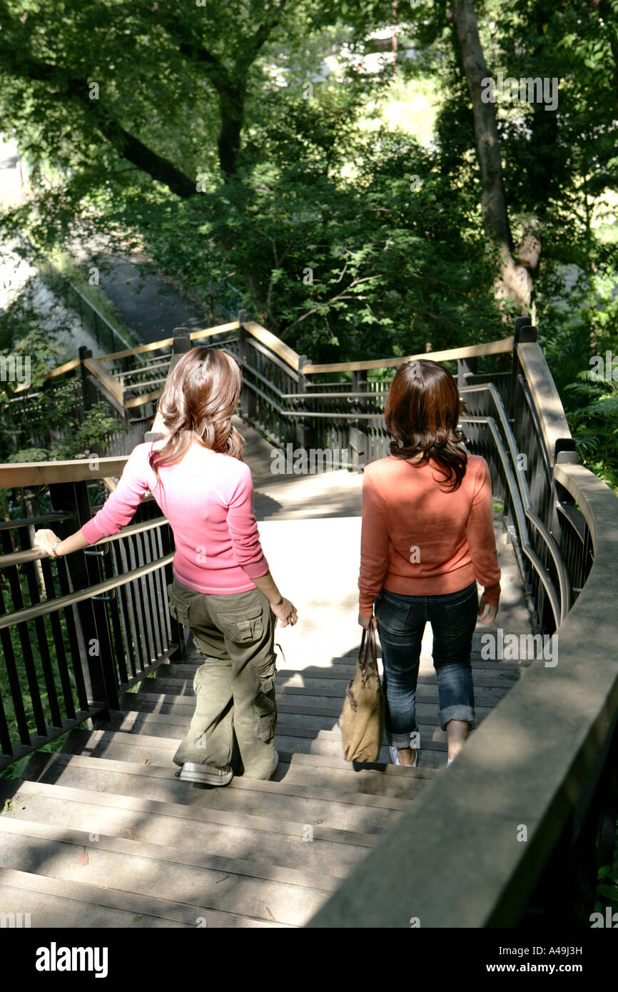 Two women walking down steps hi-res stock photography and images - Alamy
