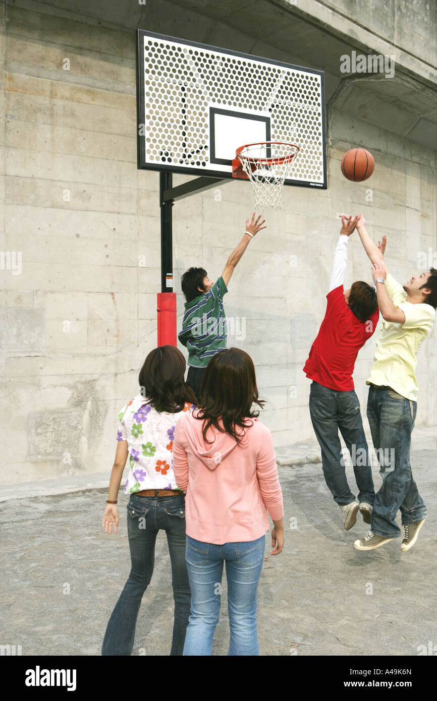 Five people playing basketball Stock Photo - Alamy