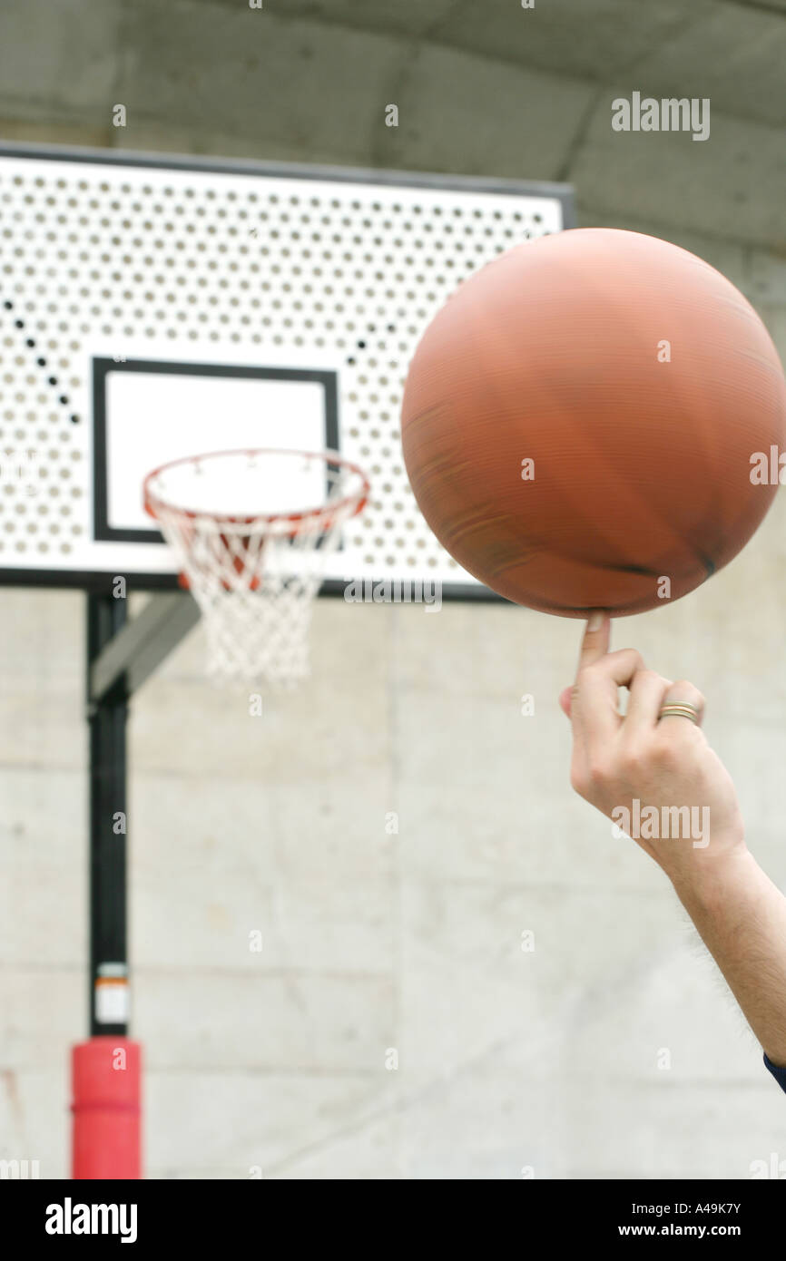 Close up of a human hand spinning a basketball Stock Photo - Alamy