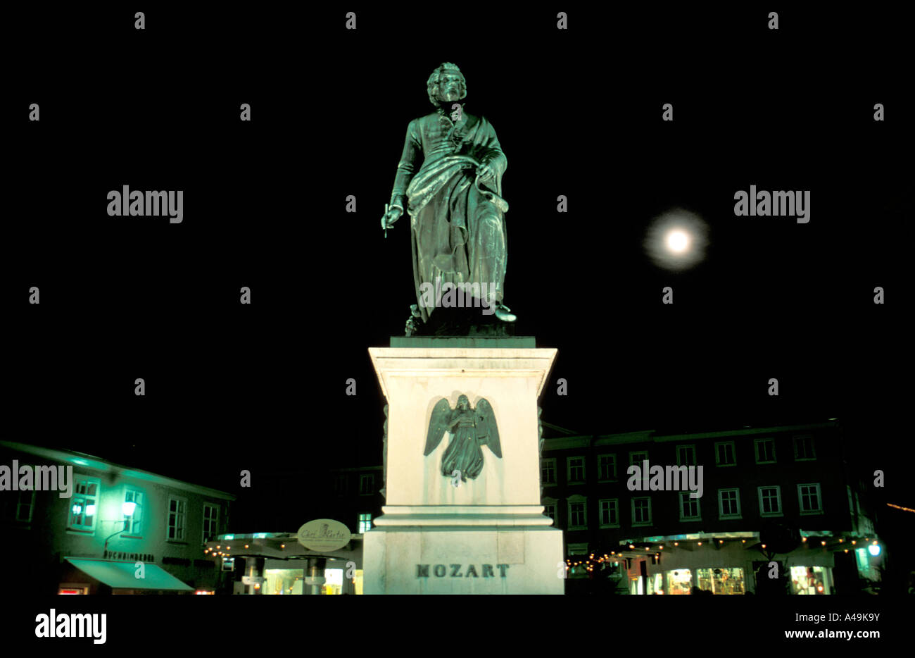 The statue of Mozart in Mozart Square by night Salzburg Austria Europe ...