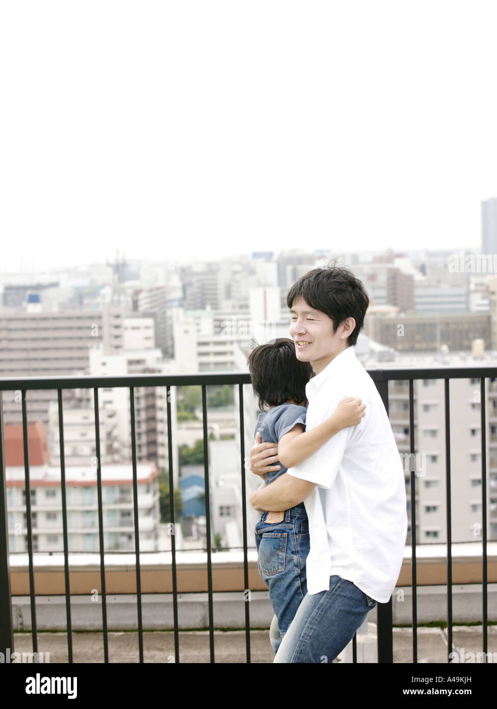 Side profile of a father embracing his son Stock Photo - Alamy
