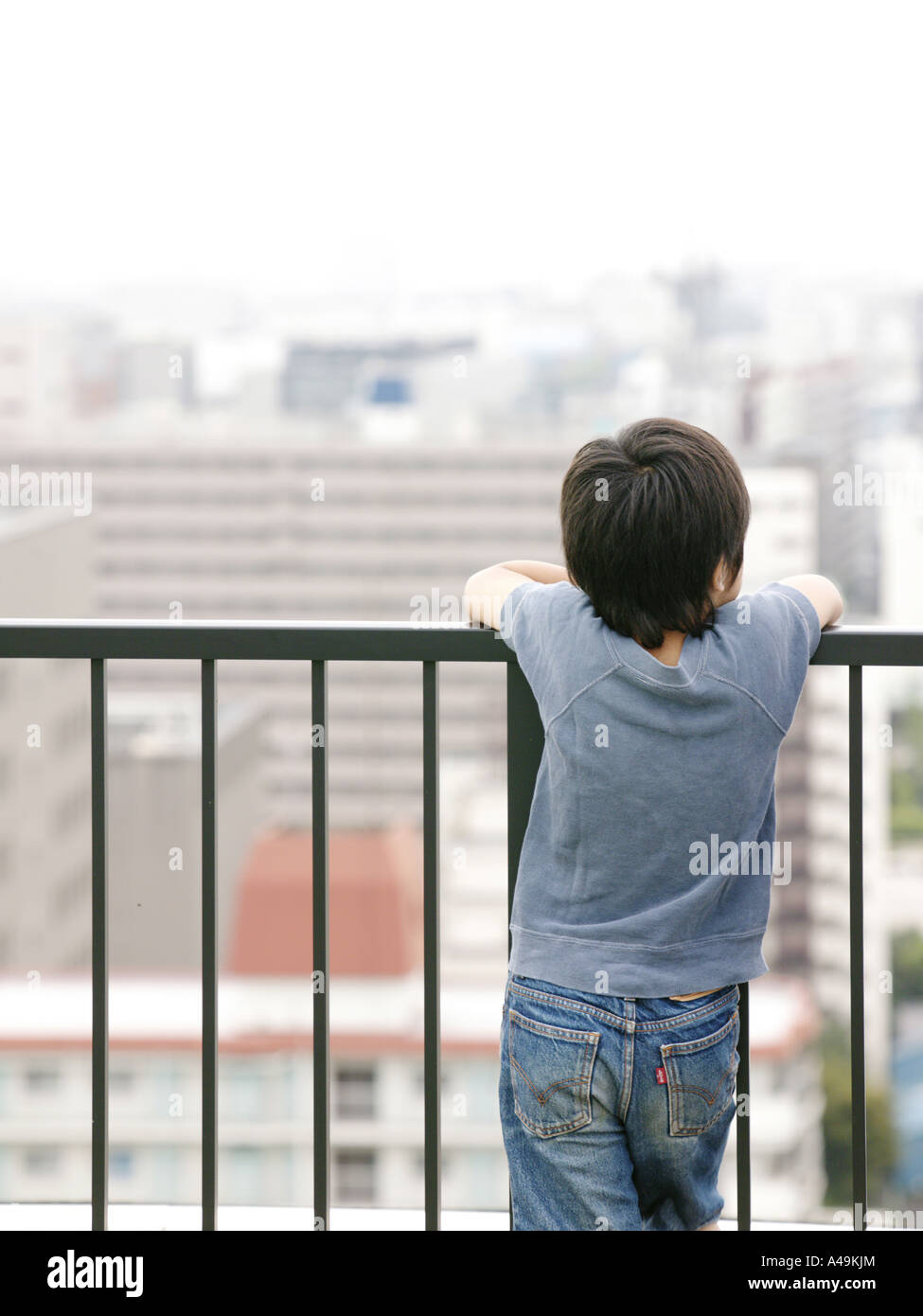 Leaning On A Railing Stock Photos & Leaning On A Railing Stock Images ...
