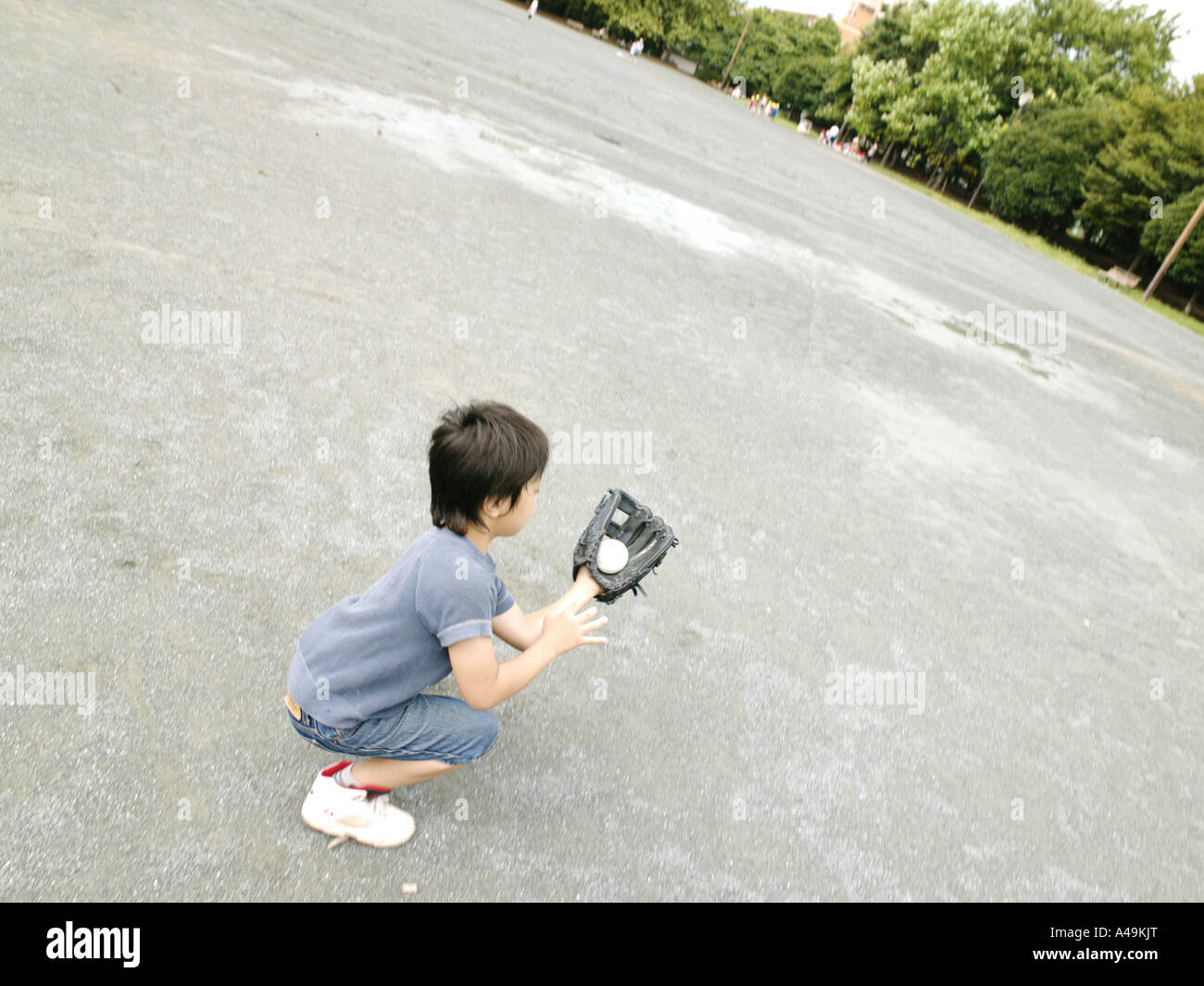 Boy catching baseball hi-res stock photography and images - Alamy