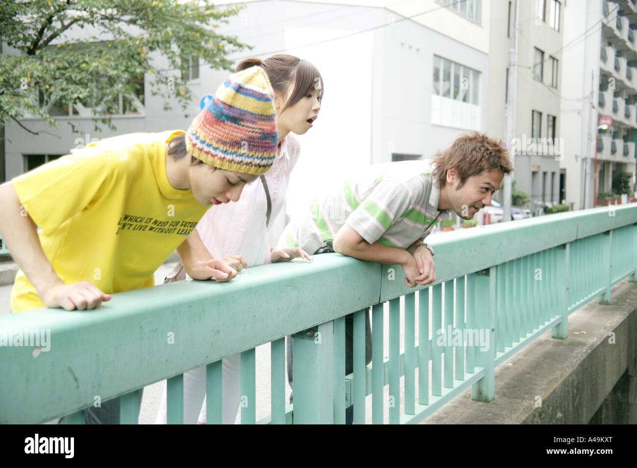 Woman looking down over railing hi-res stock photography and images - Alamy