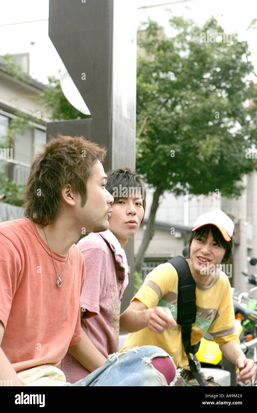 Three young men talking Stock Photo - Alamy Three young men talking Stock Photo - Alamy