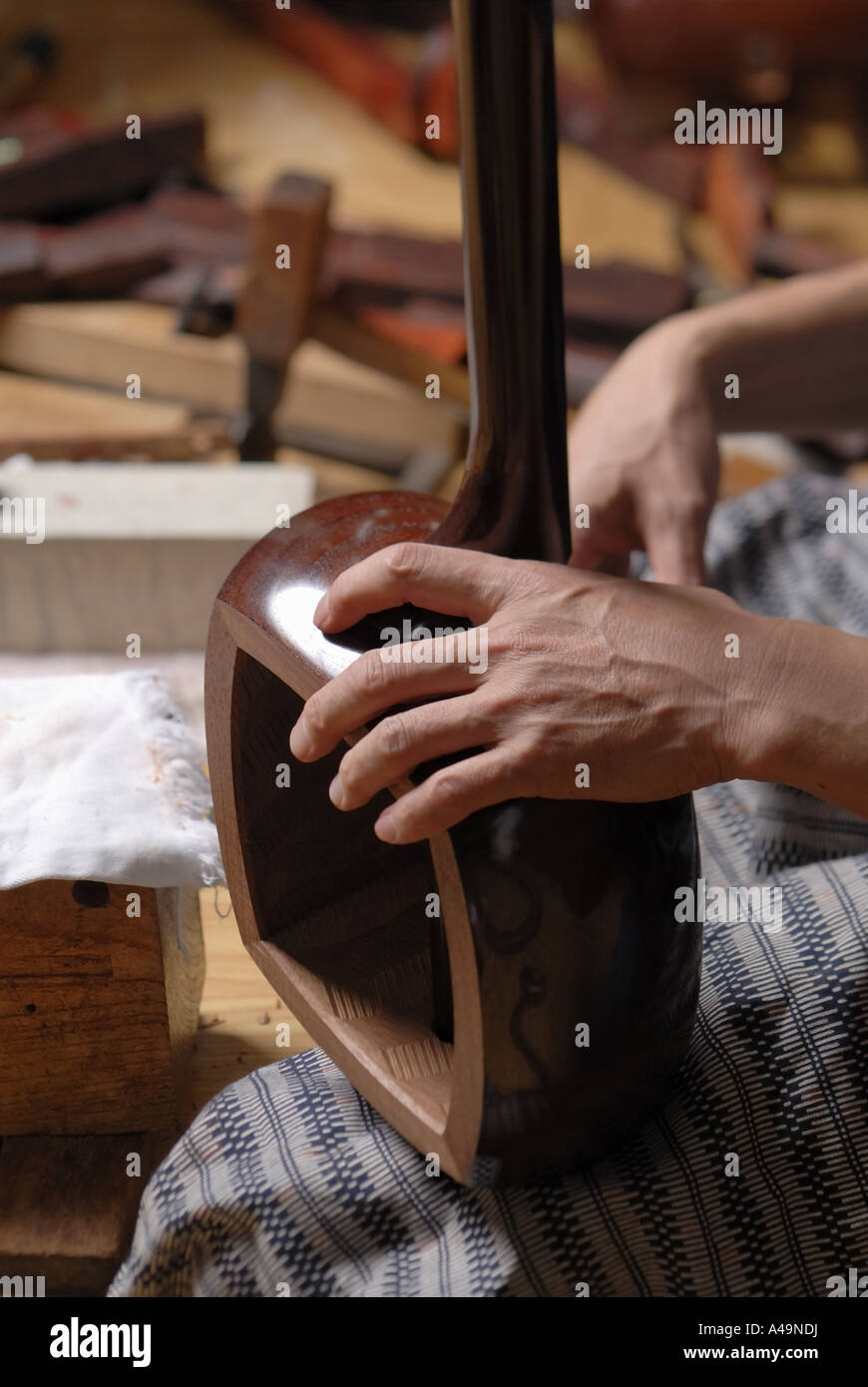 Close up of a carpenter s hand making samisen Stock Photo - Alamy