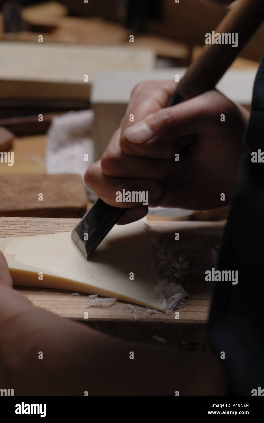 Close up of a person s hand planing wood with a chisel Stock Photo - Alamy