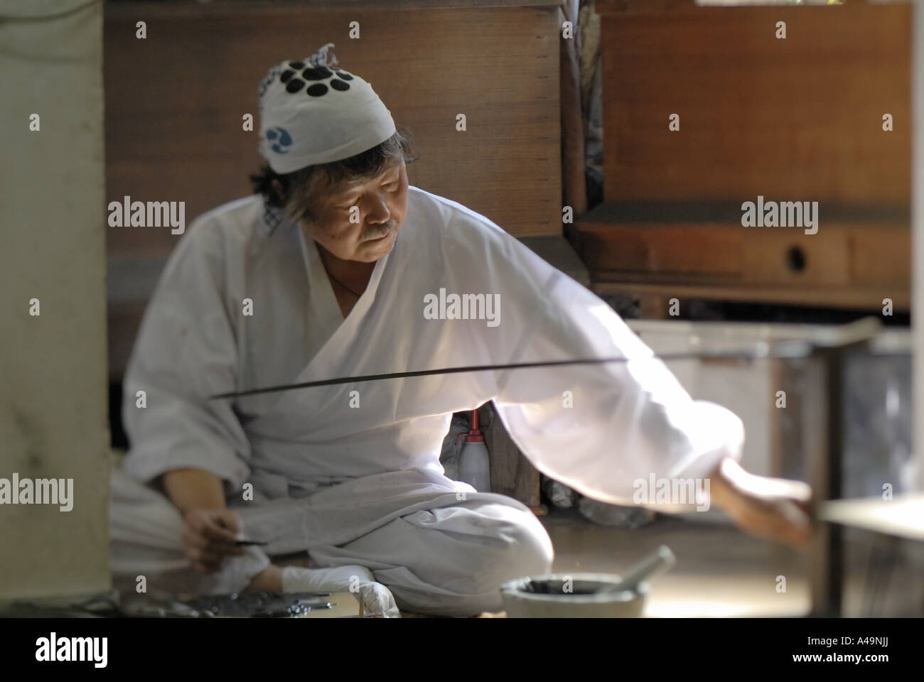 Blacksmith working on a sword in a workshop Stock Photo - Alamy