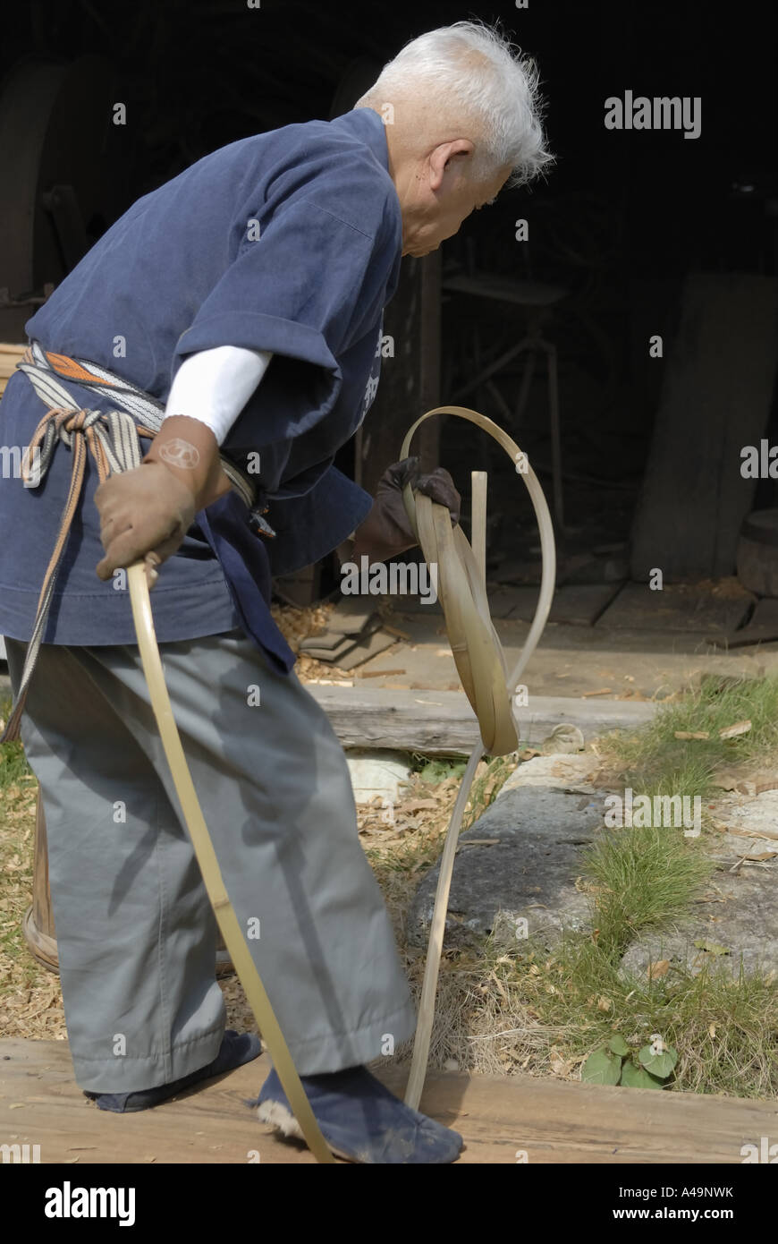 Side profile of a carpenter twisting cane Stock Photo - Alamy