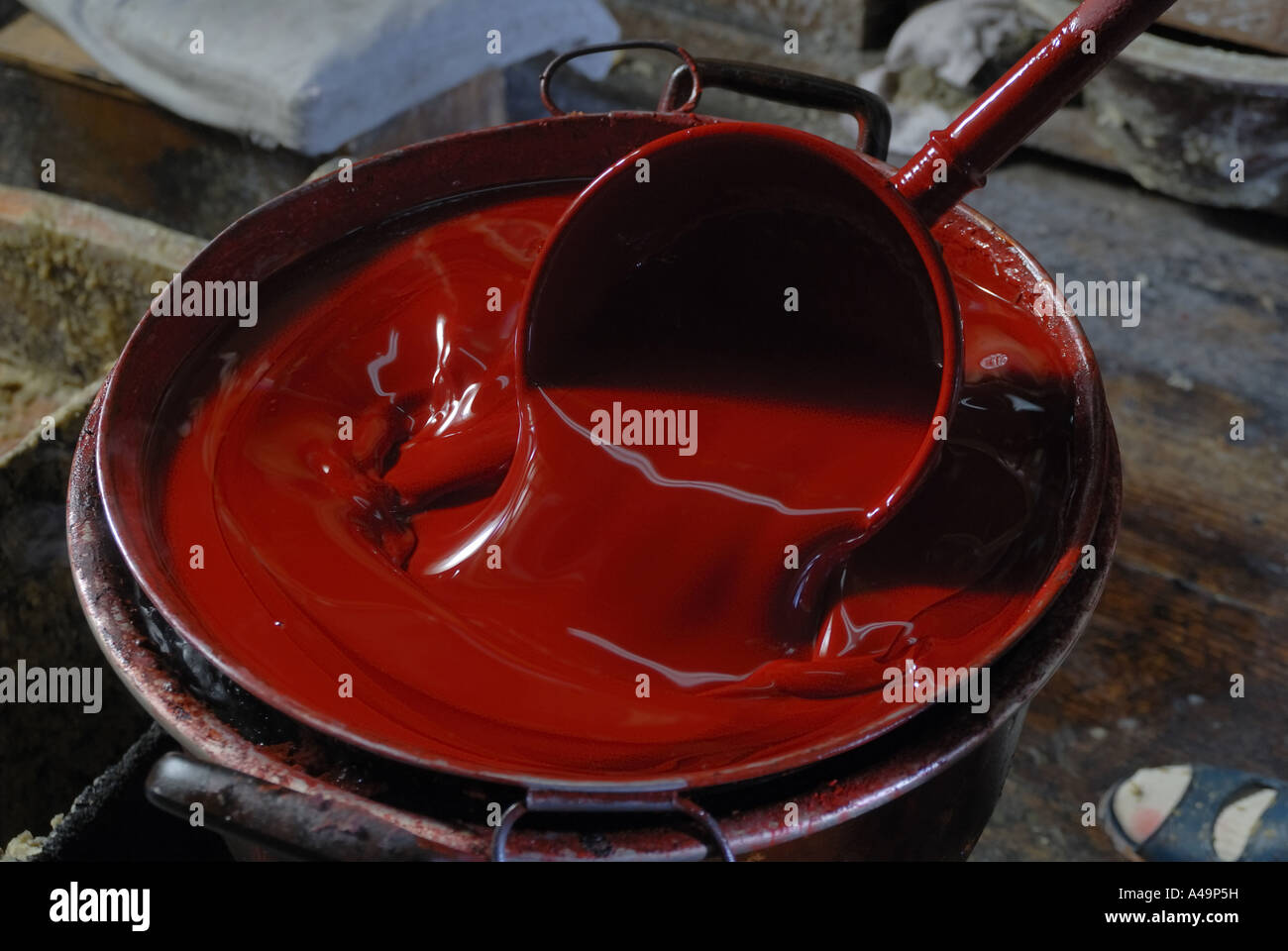 Ladle in a paint can Stock Photo - Alamy