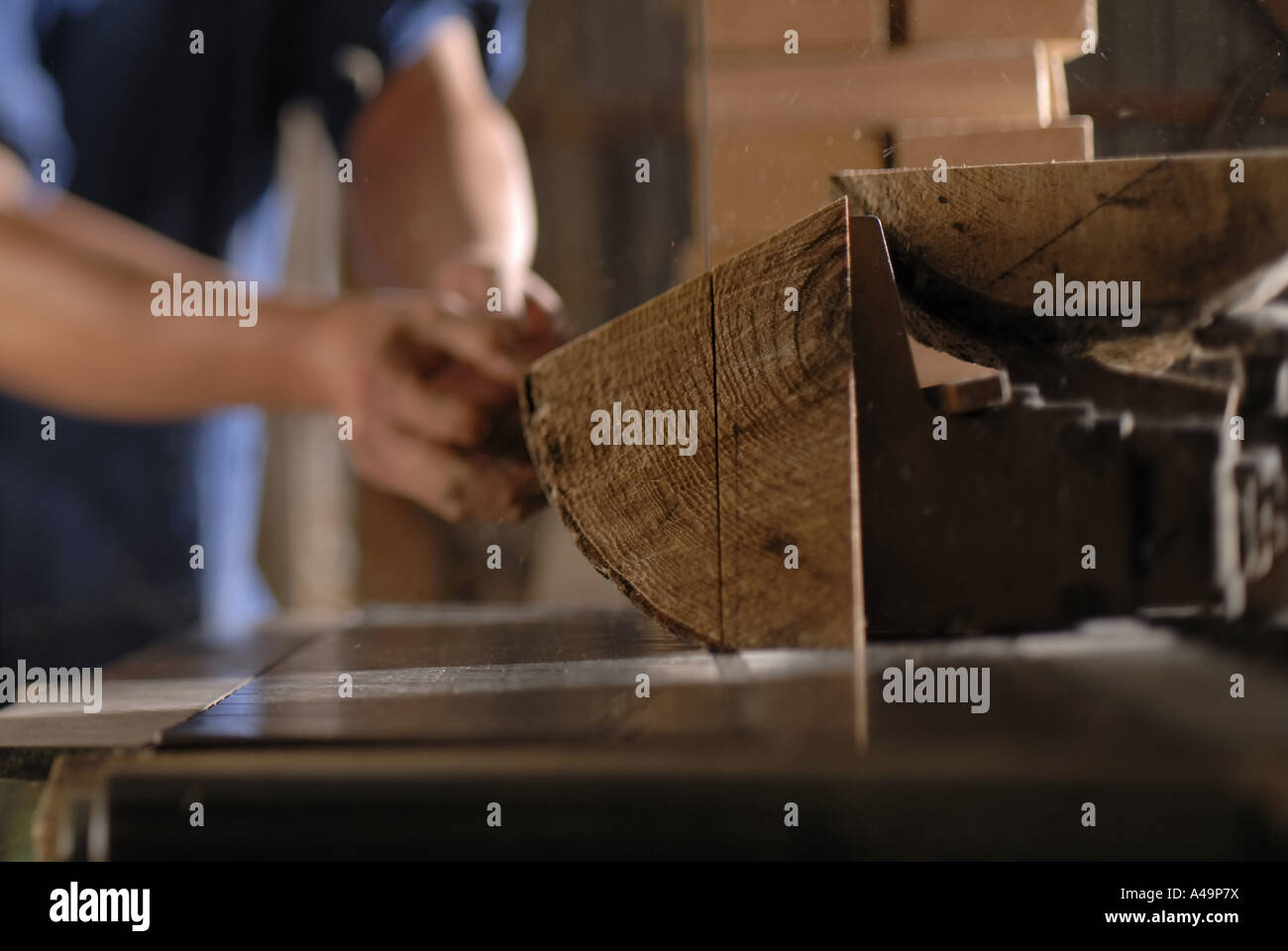 Mid section view of a carpenter cutting wood in a workshop Stock Photo ...