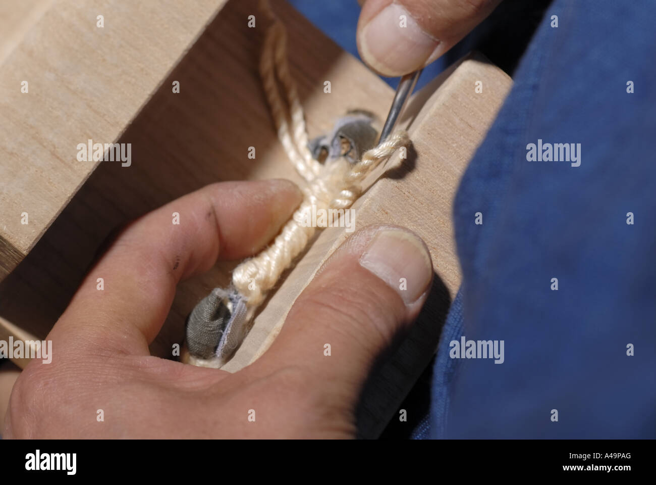 Close up of a person using a needle Stock Photo - Alamy