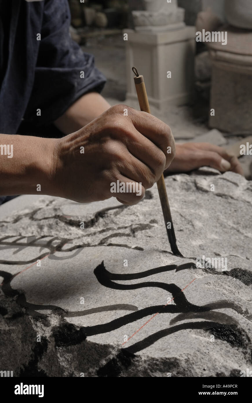 Close up of a human hand drawing on a rock Stock Photo - Alamy
