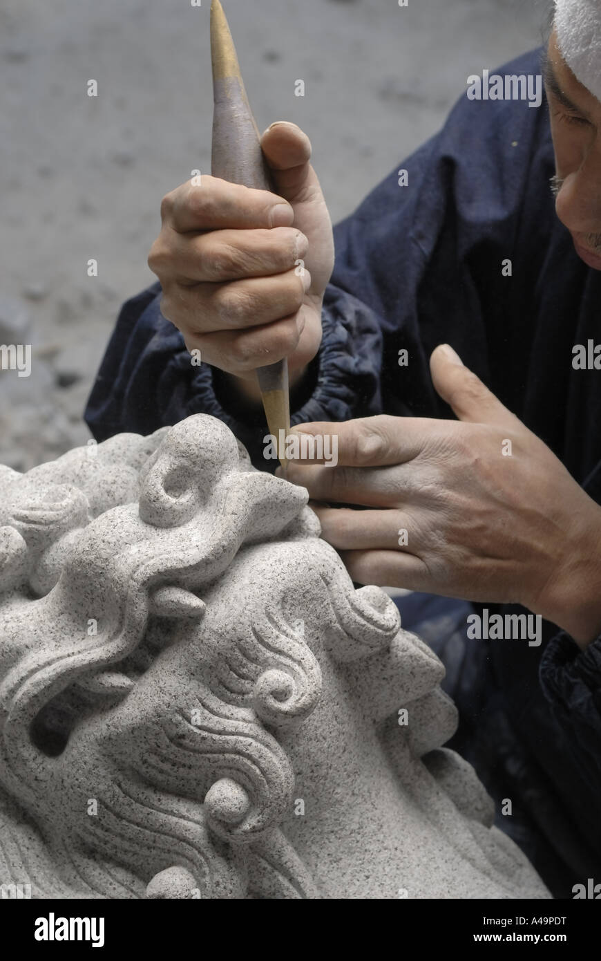 Close up of a sculptor carving a statue with a chisel Stock Photo - Alamy