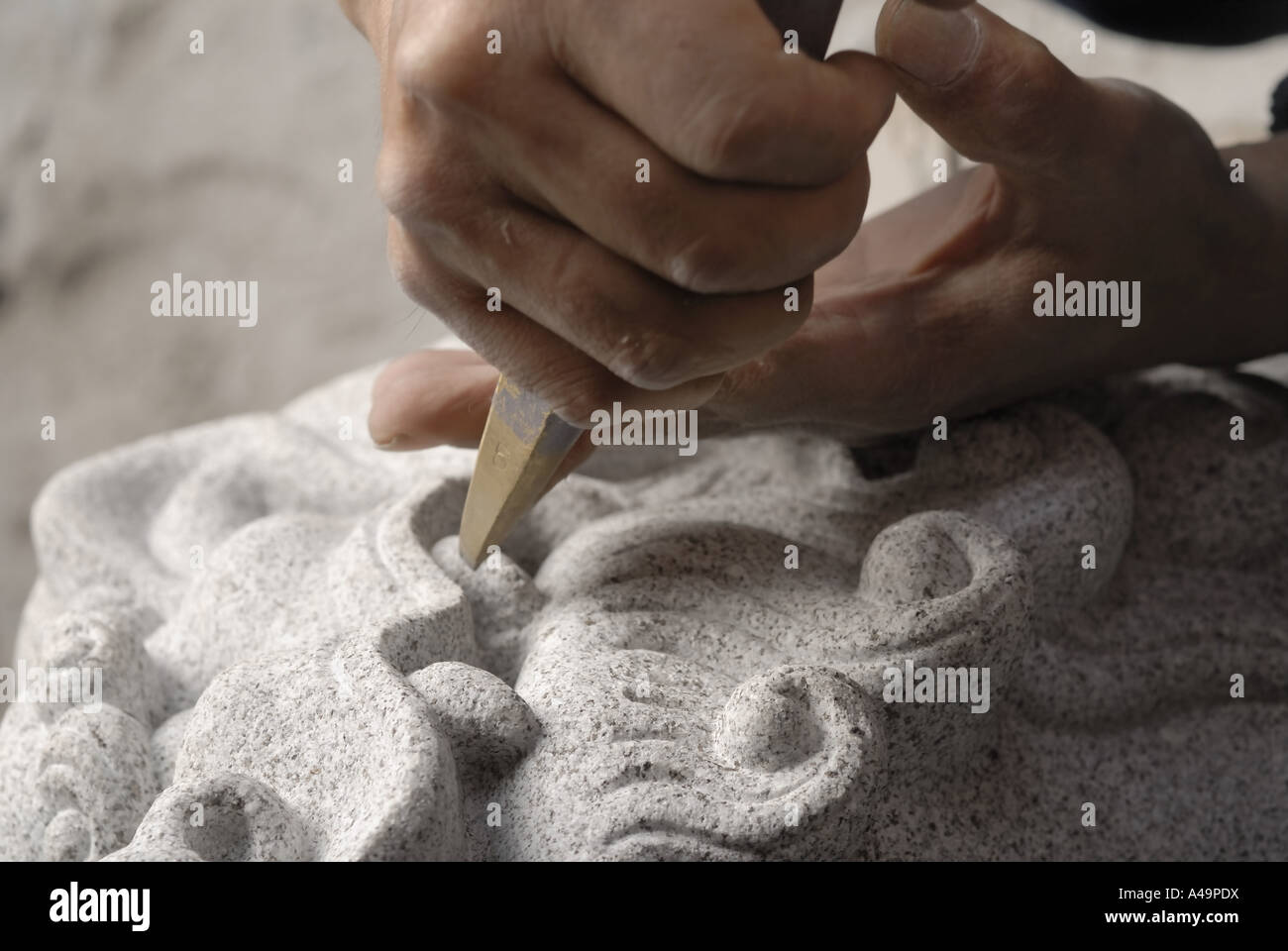 Close up of a person s hand carving a statue with a chisel Stock Photo ...